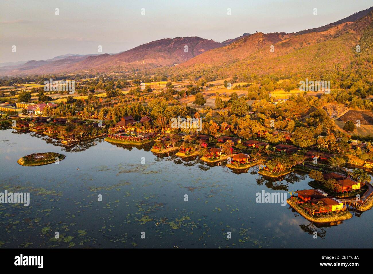 Aerial by drone of the overwater bungalows at the shores of Inle Lake ...