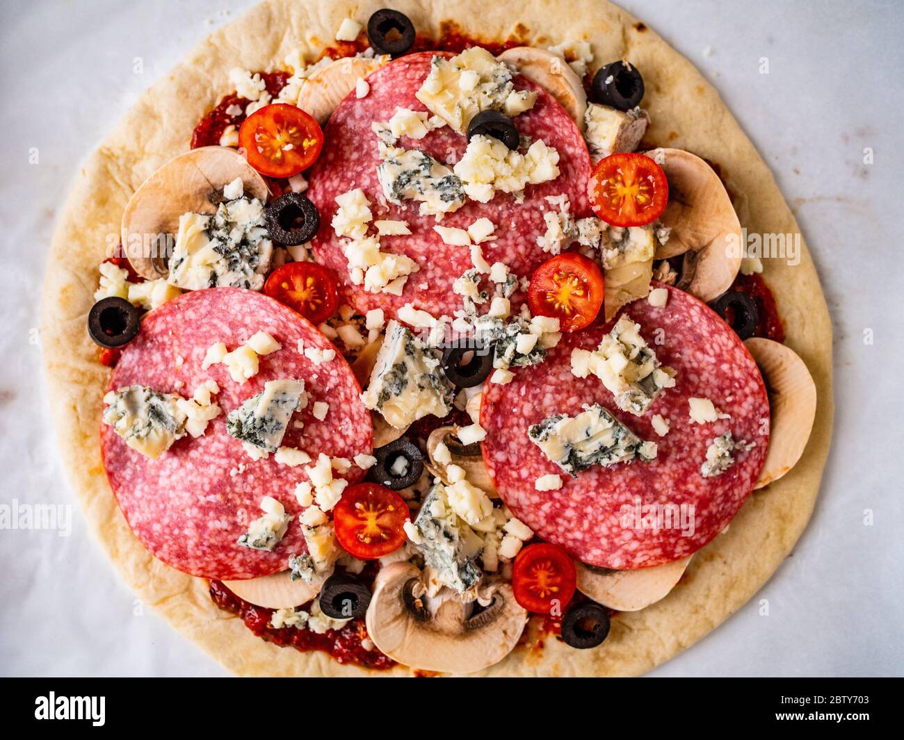 Uncooked margherita pizza overhead hi-res stock photography and images ...