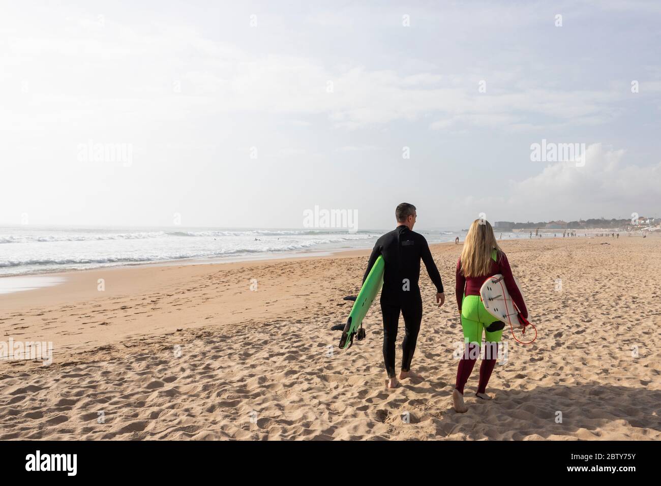 Family going to surf Stock Photo - Alamy