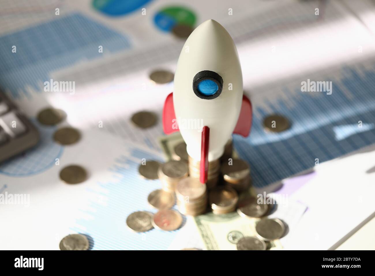 Bright rocketship on desk Stock Photo - Alamy
