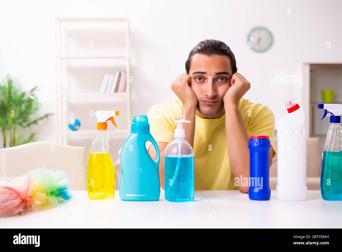 Young contractor doing housework at home Stock Photo - Alamy