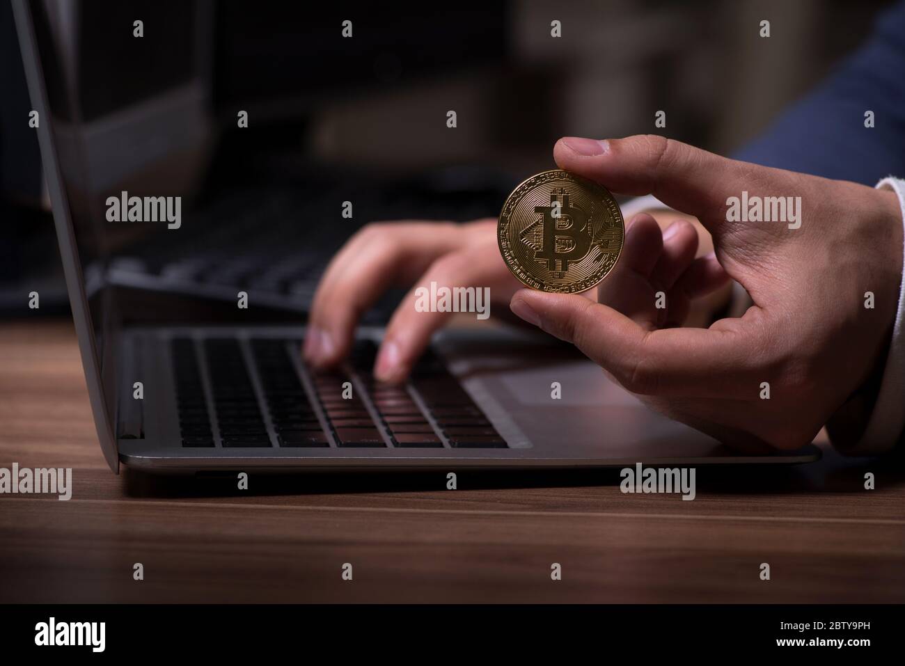 Male hacker hacking security firewall late in the office Stock Photo ...