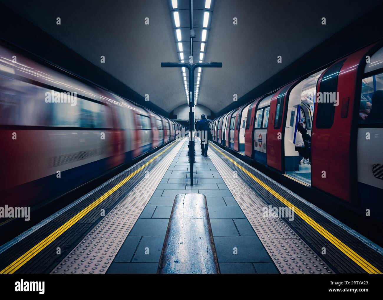 One stationary and one underground train in motion, London Tube Station ...