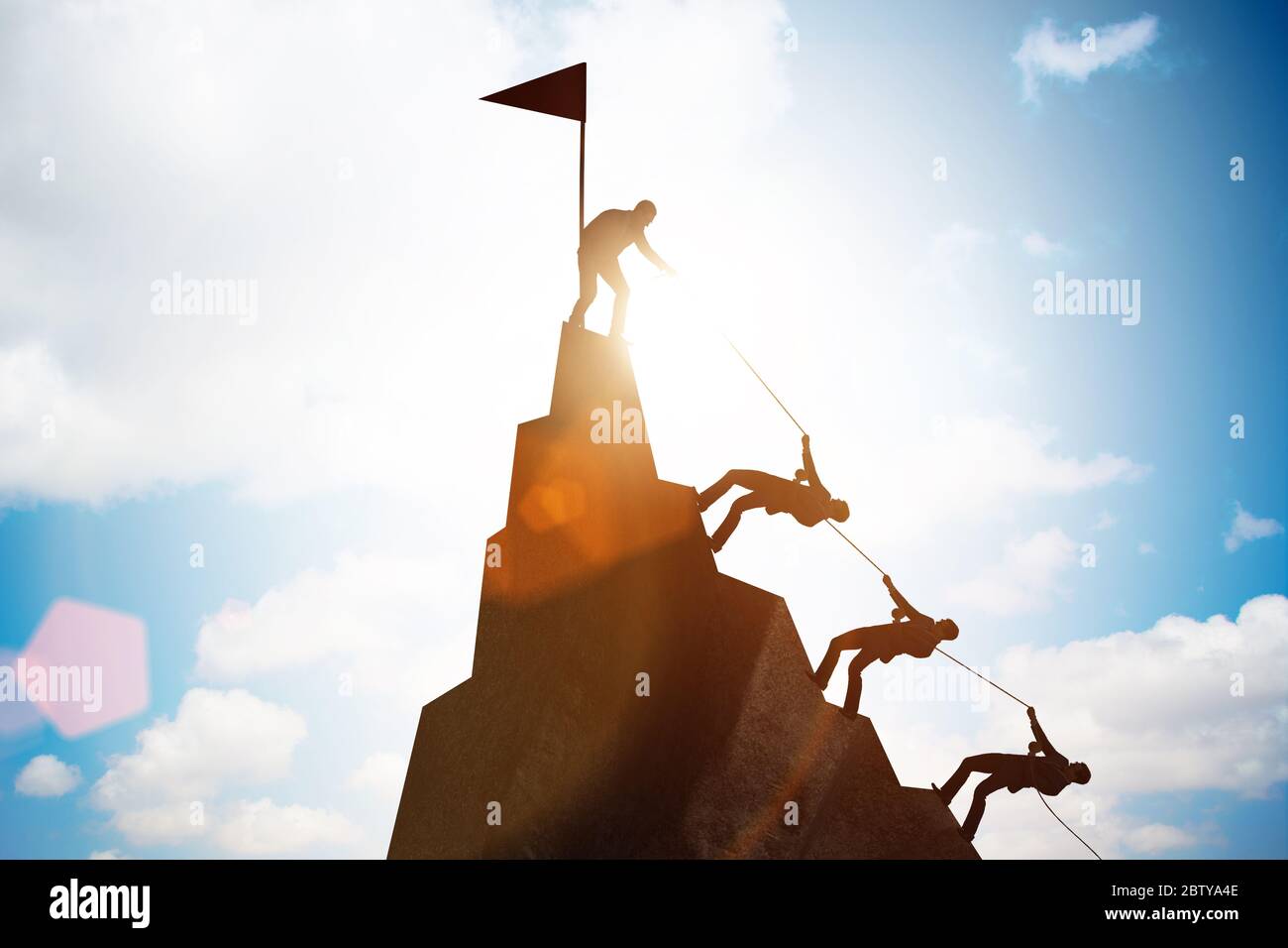 Concept of teamwork with team climbing mountain Stock Photo - Alamy