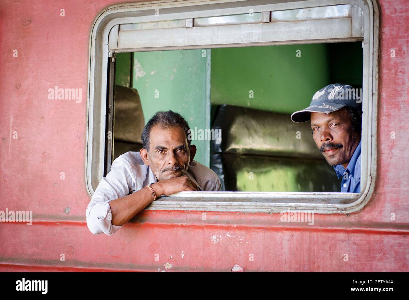 Two men on a train, Ella train station, Sri Lanka, Asia Stock Photo - Alamy