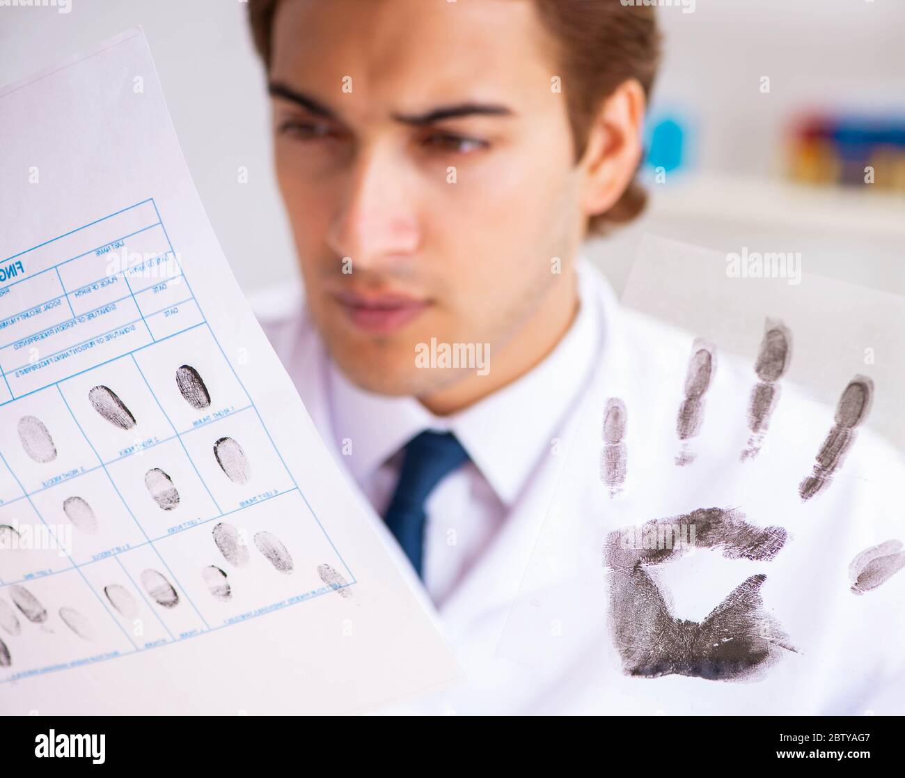 The forensic expert studying fingerprints in the lab Stock Photo - Alamy