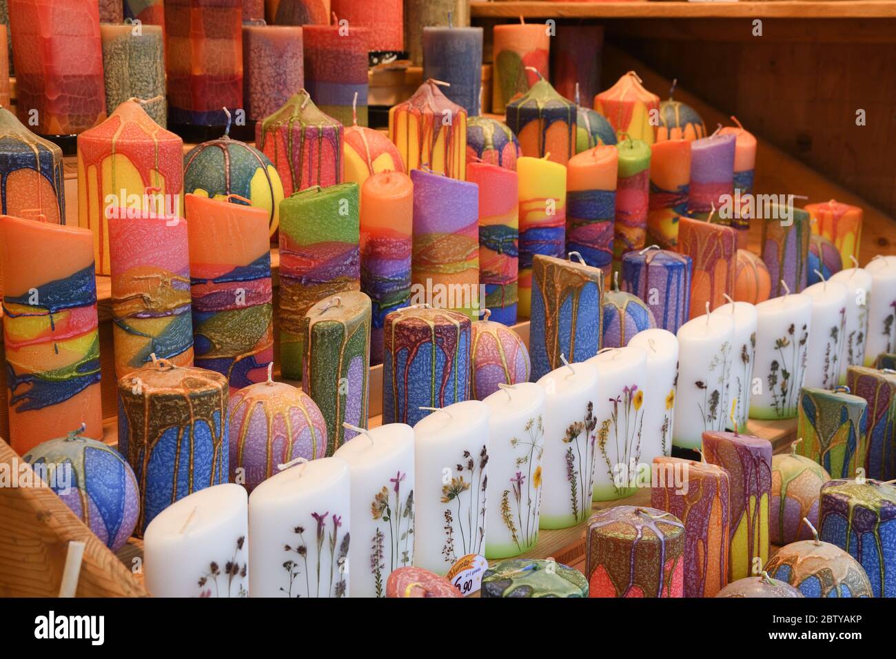 Many multicolored colorful red orange yellow paraffin stick candles ...