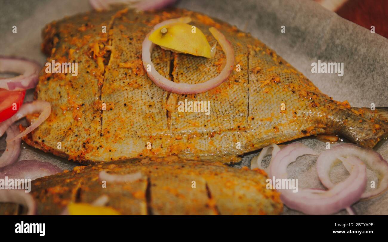 Black Pomfret with indian masala ready grill Stock Photo - Alamy