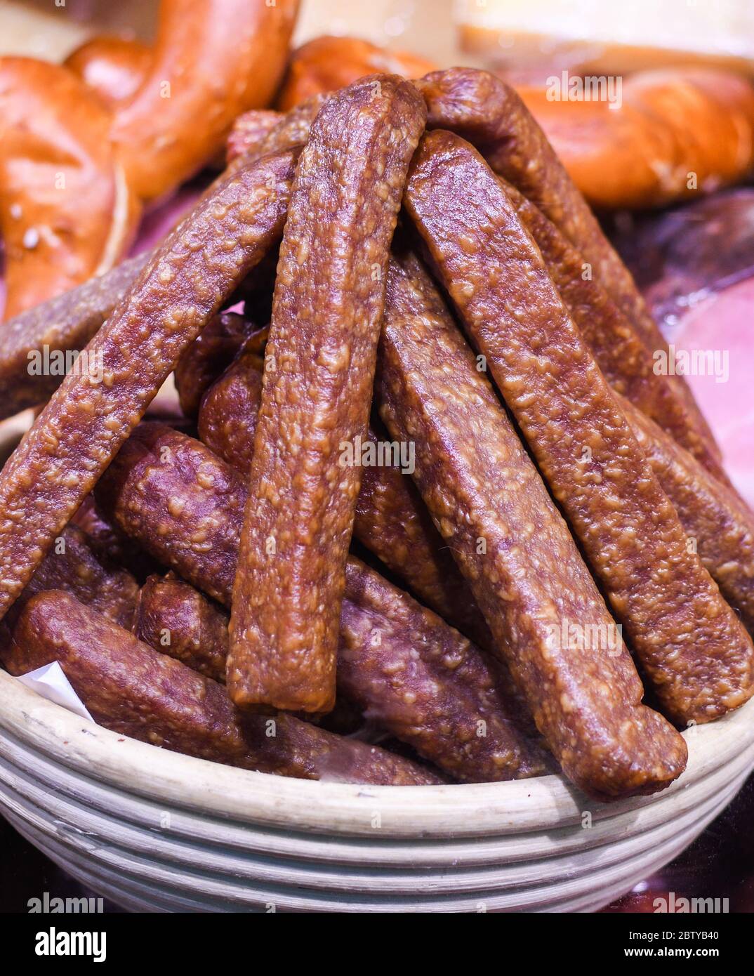 Many homemade German mix of meat specialties, speck ham sausages pile ...