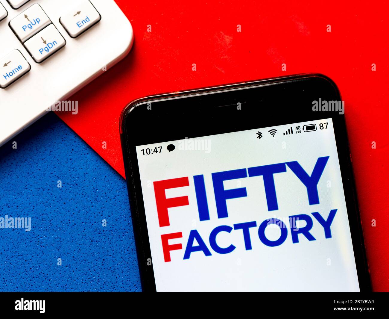 In this photo illustration a Fifty Factory logo seen displayed on a ...