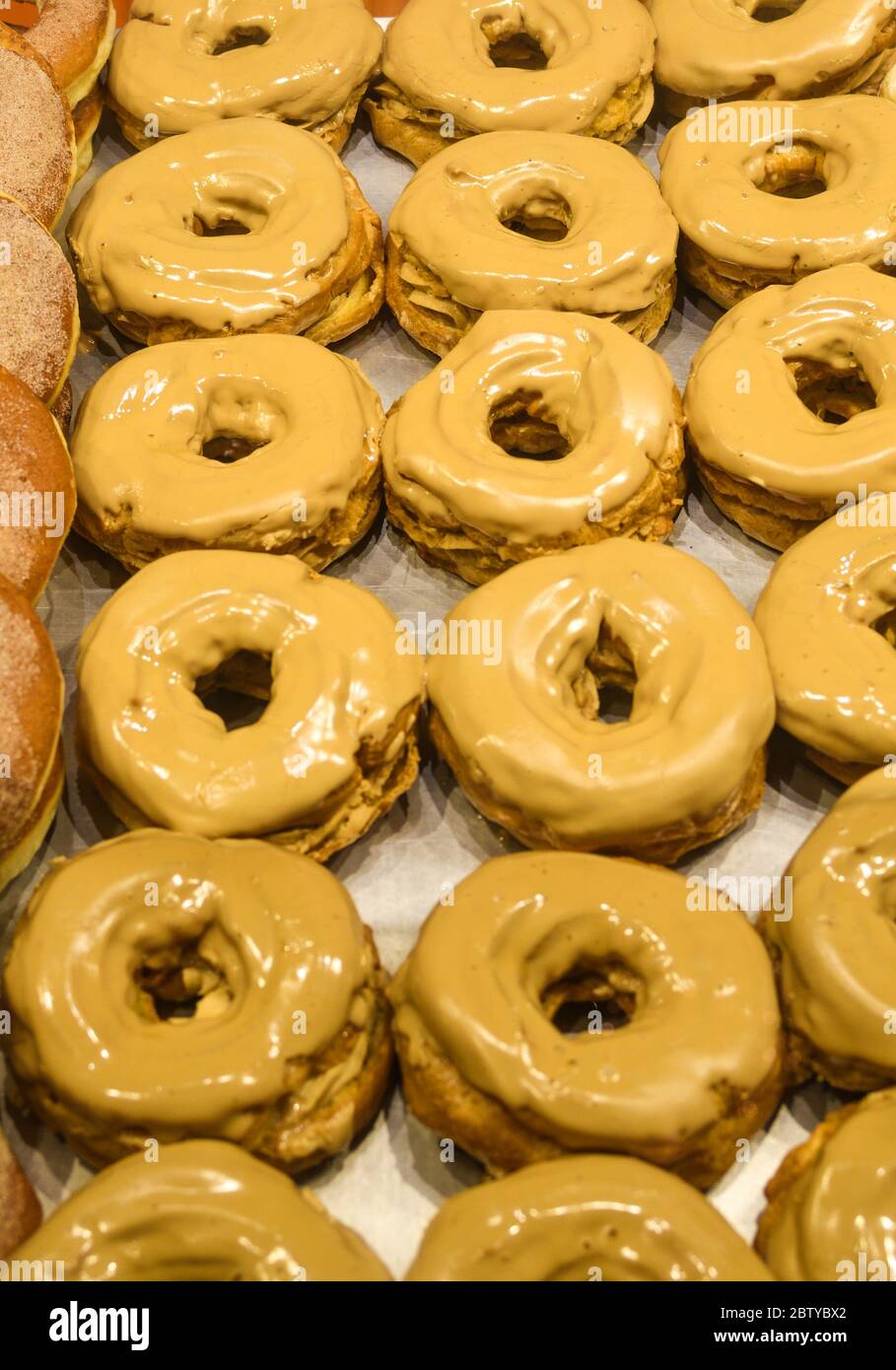 Display of traditional doughnuts on sale at Christmas market stall in ...
