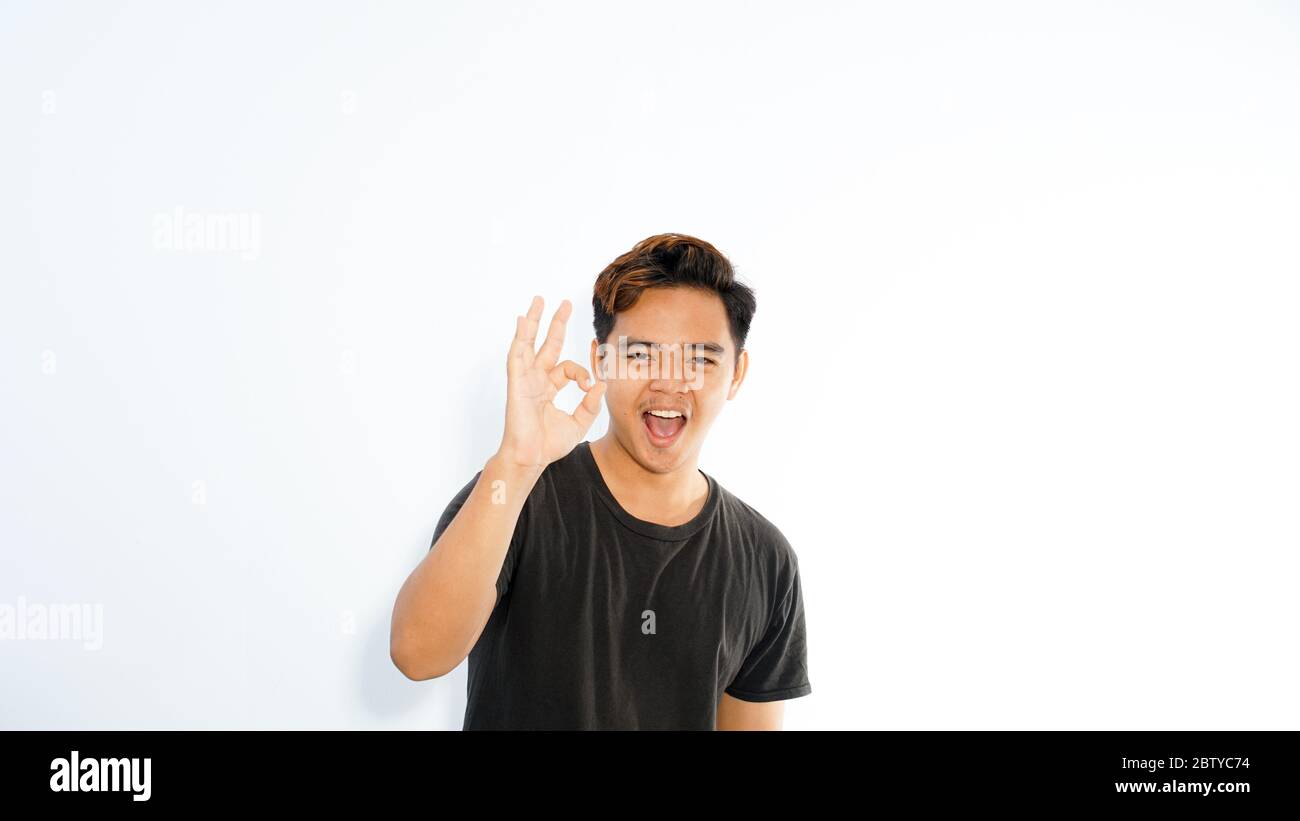Happy asian boy raising hand hi-res stock photography and images - Alamy
