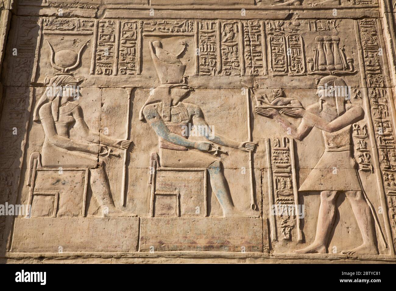 Gods Hathor on left and Haroeris in centre with Pharaoh on the right ...