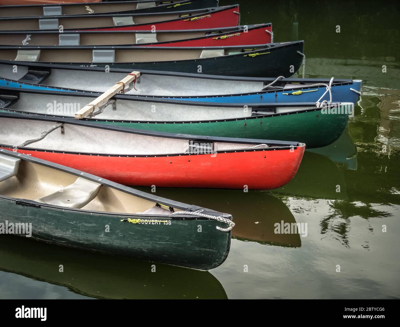 Colourful canoes on one of London's former docks Stock Photo - Alamy