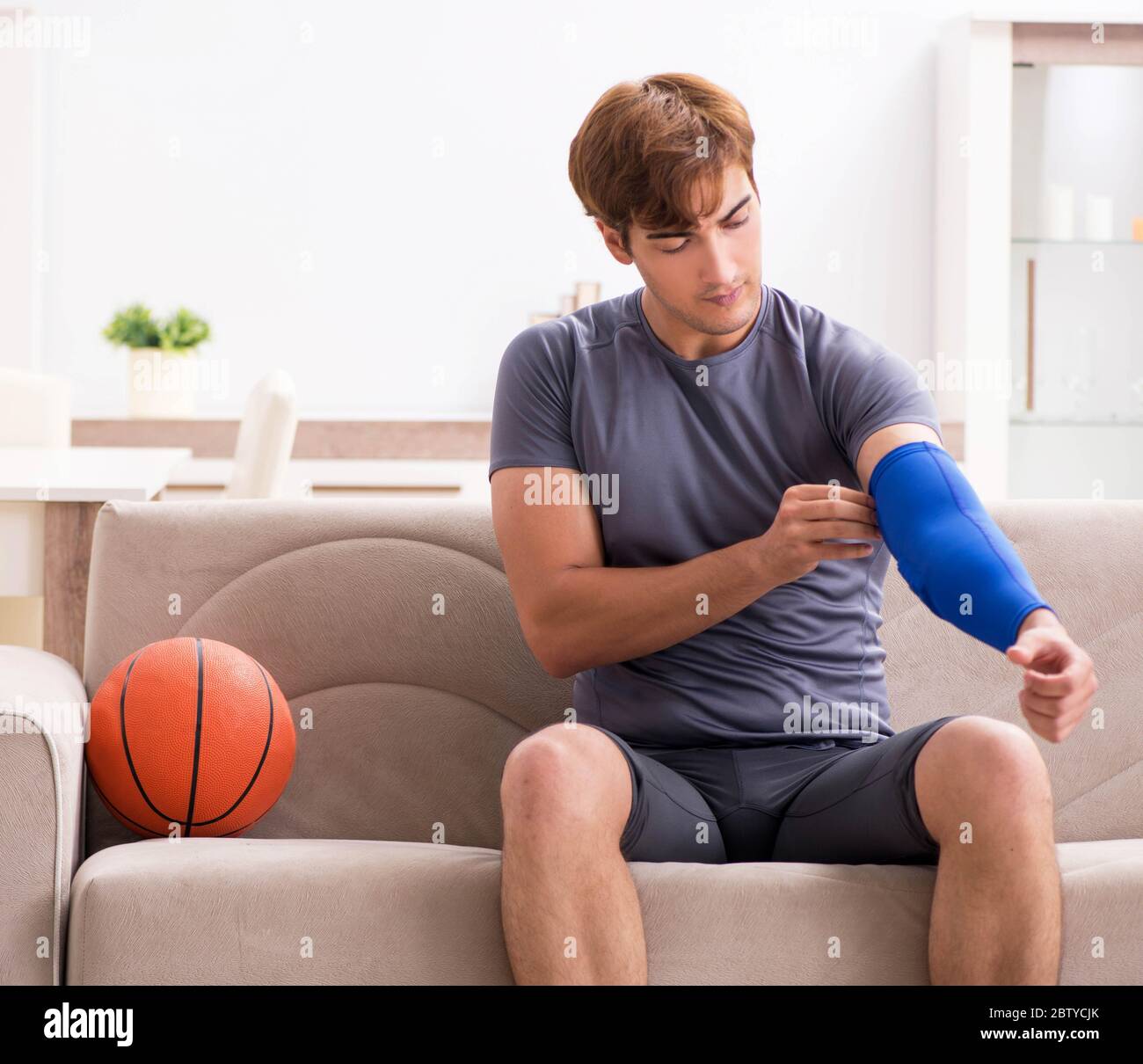 The injured man recovering at home from sports injury Stock Photo - Alamy