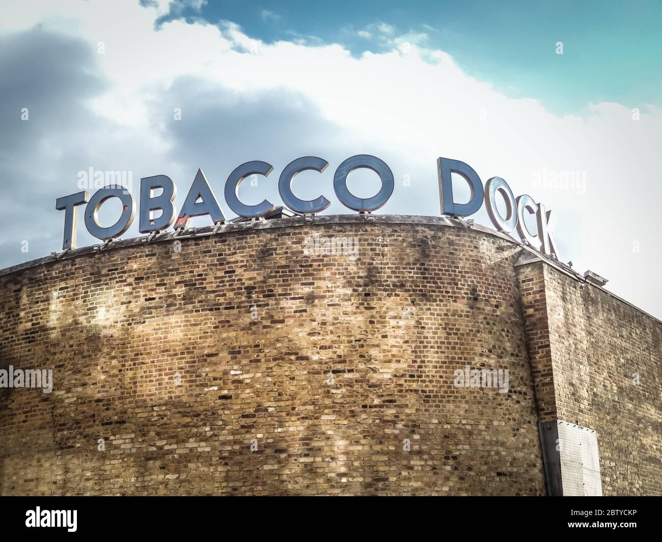Signage outside the historic Tobacco Dock bonded warehouse on Tobacco ...