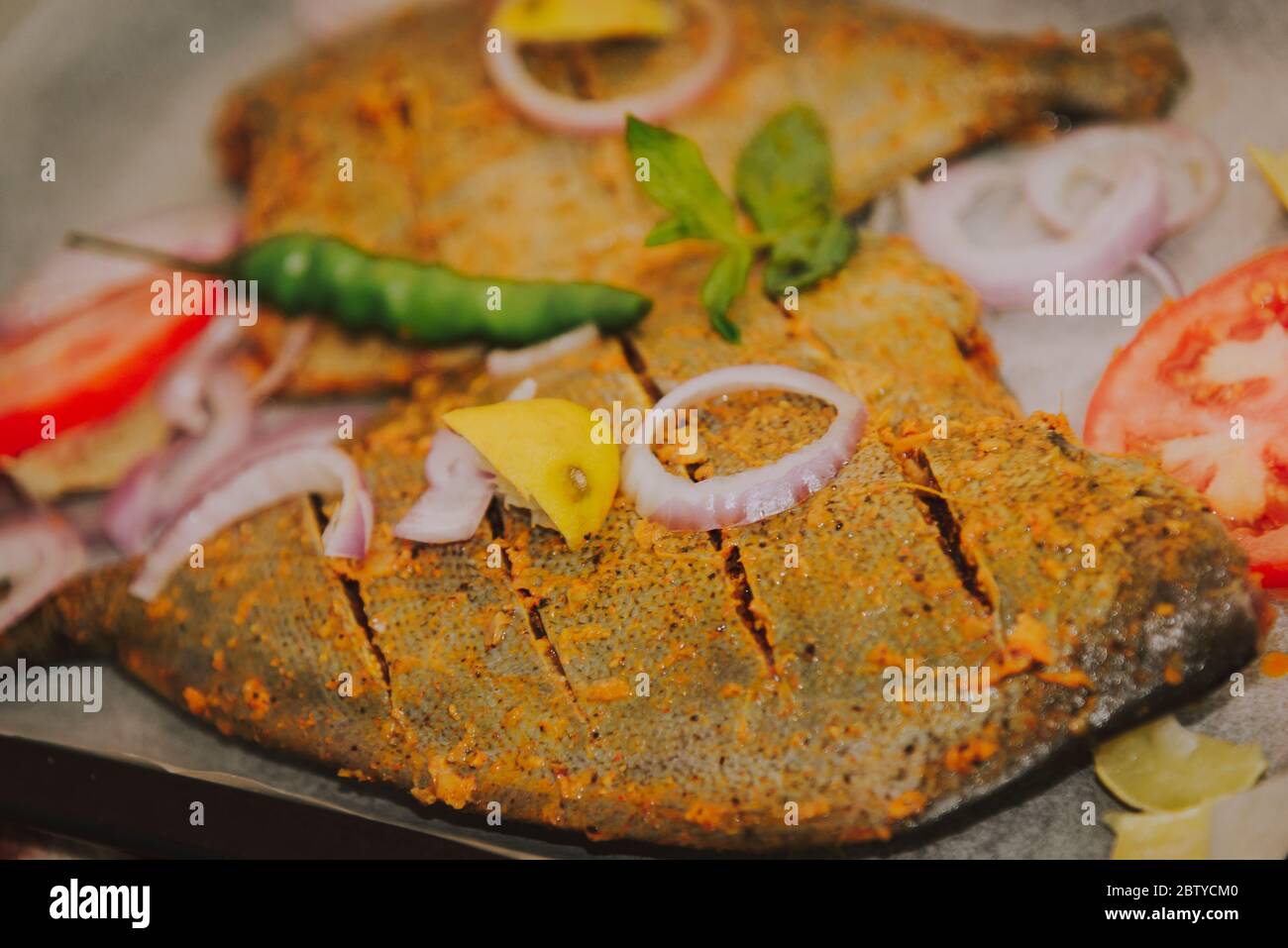 Black Pomfret with indian masala ready grill Stock Photo - Alamy