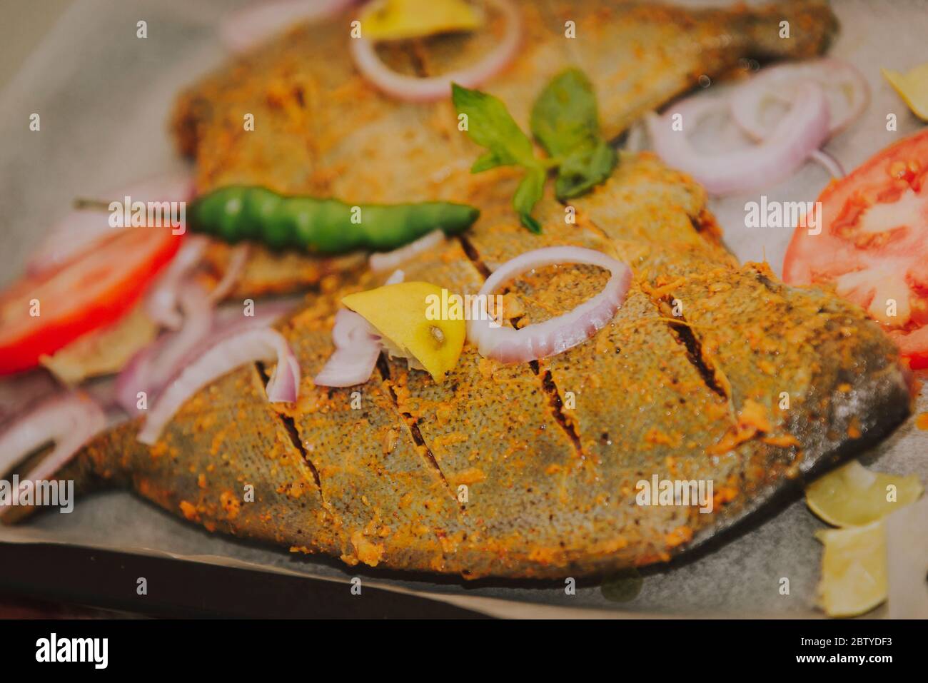 Black Pomfret with indian masala ready grill Stock Photo - Alamy
