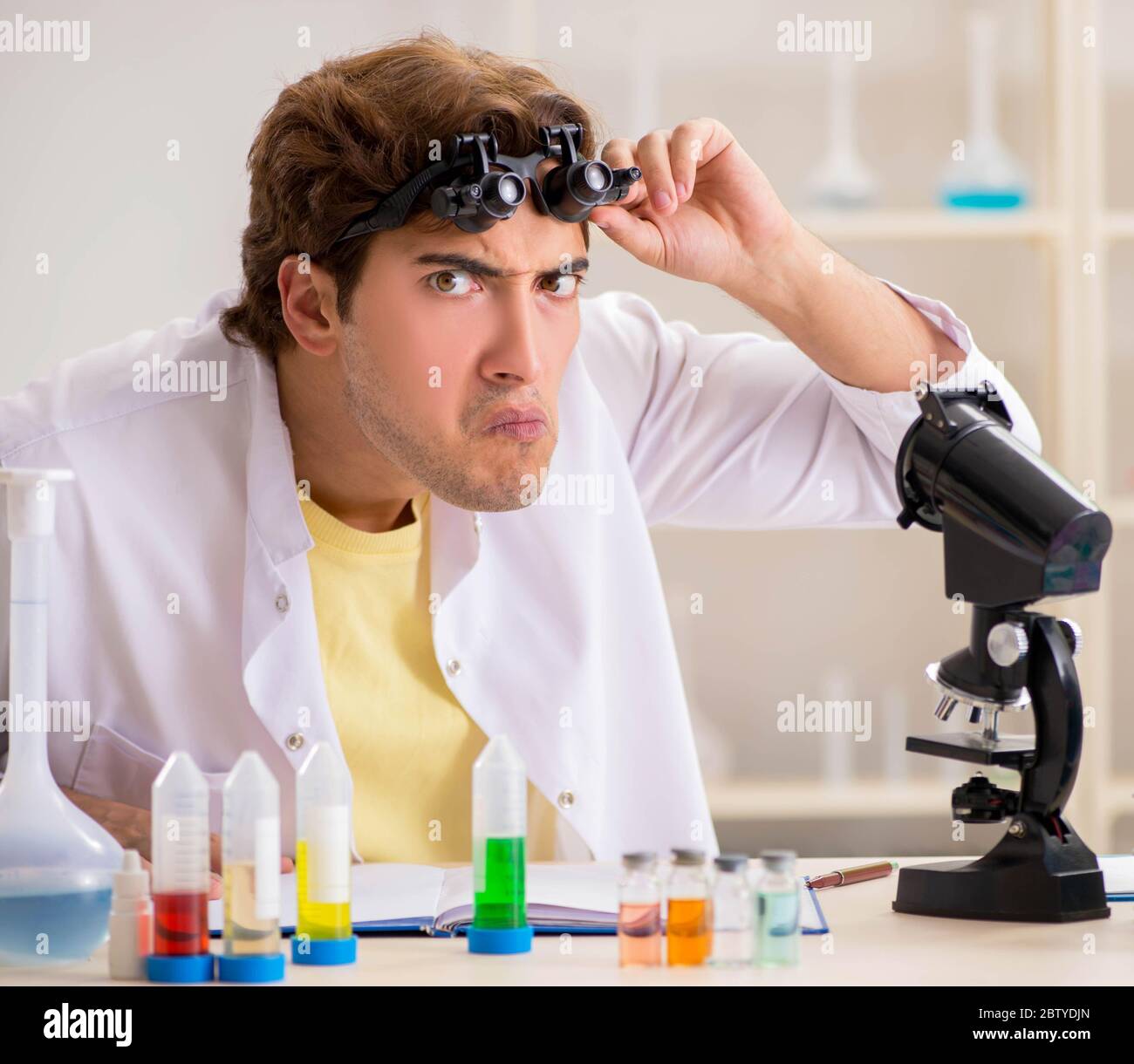 The funny crazy chemist doing experiments and tests Stock Photo - Alamy