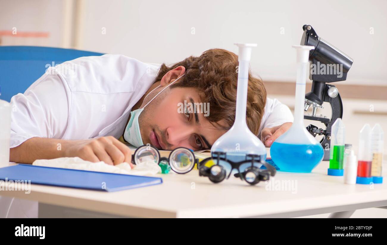 The funny crazy chemist doing experiments and tests Stock Photo - Alamy