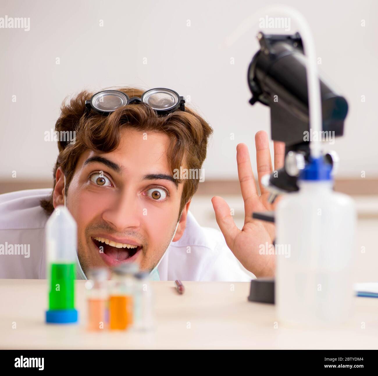 The funny crazy chemist doing experiments and tests Stock Photo - Alamy