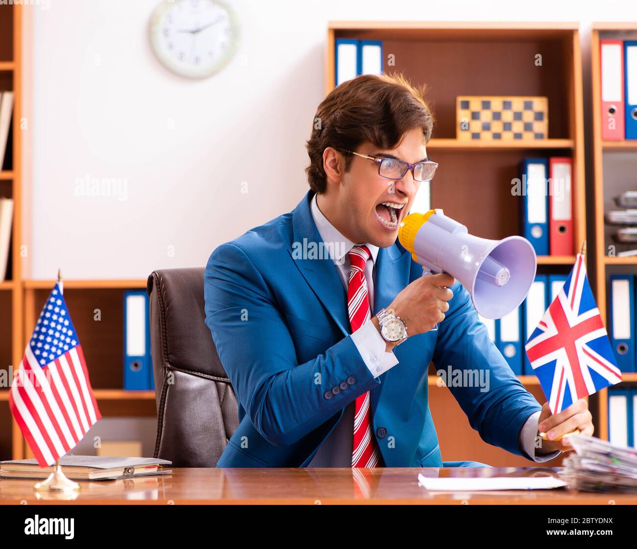 The young handsome politician sitting in office Stock Photo - Alamy