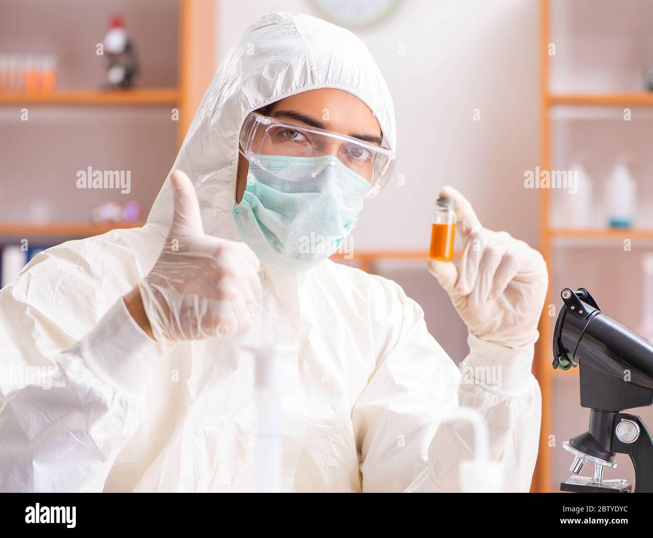 The young biochemist wearing protective suit working in the lab Stock ...
