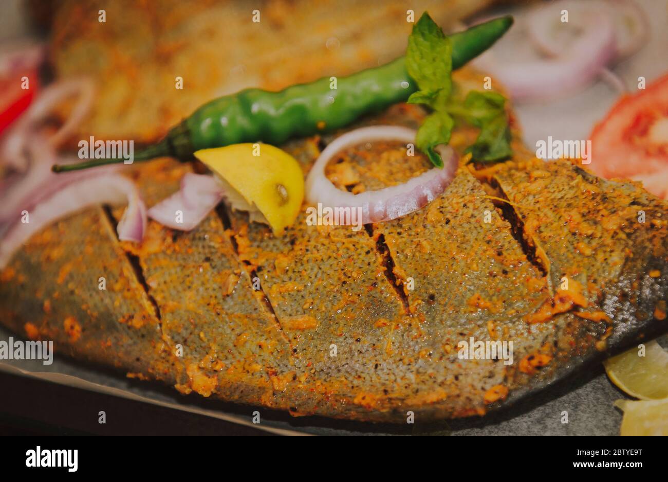 Black Pomfret with indian masala ready grill Stock Photo - Alamy