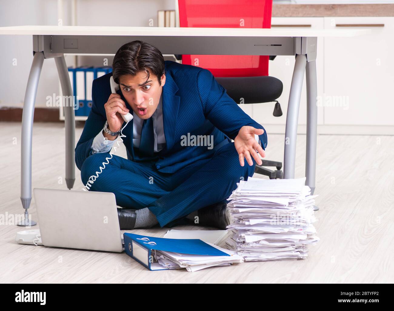 The tired exhausted businessman working overtime in office Stock Photo ...