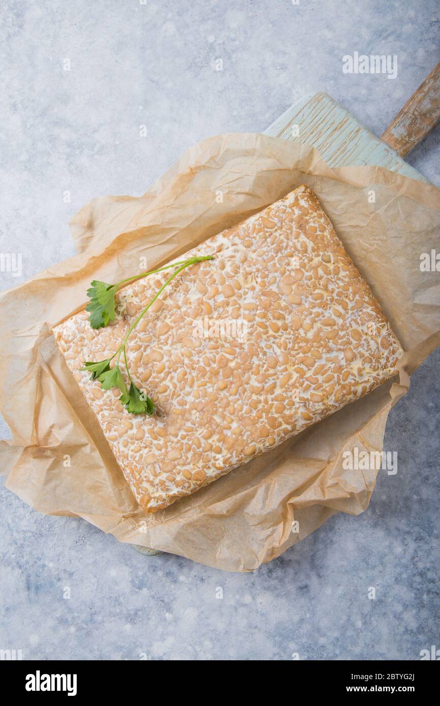 Slice of tempeh or tempe made of fermentation process that binds ...