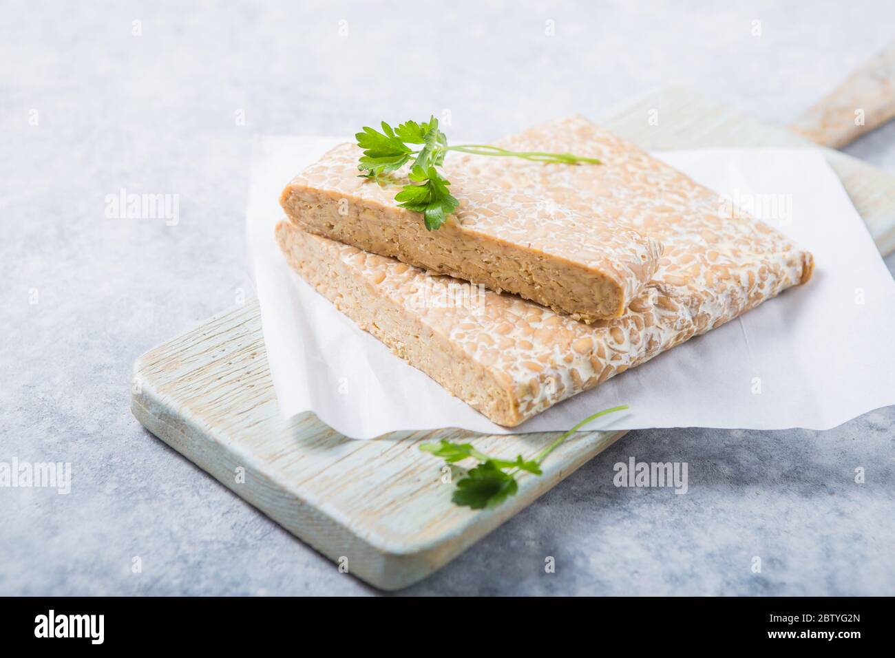 Slice of tempeh or tempe made of fermentation process that binds ...