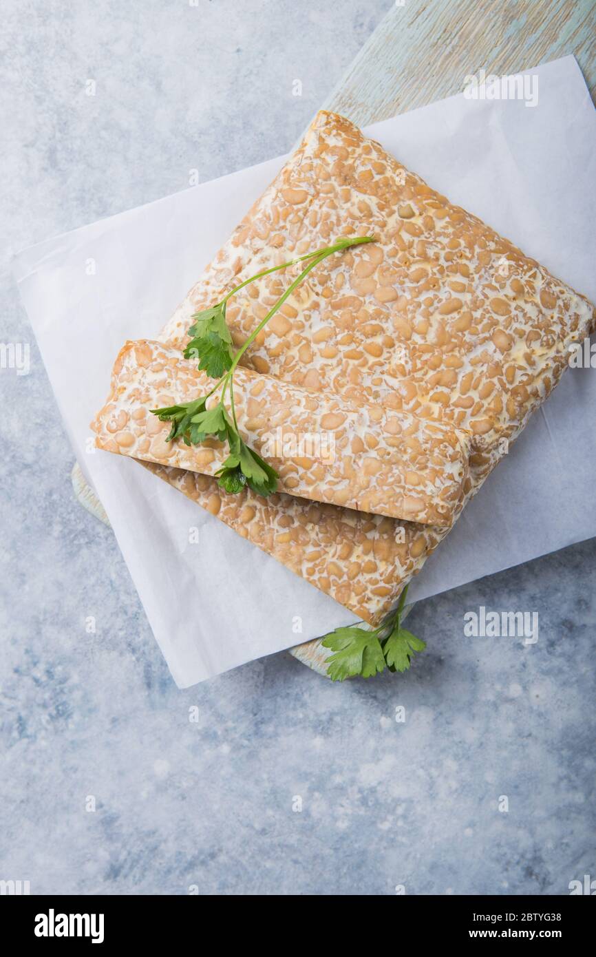 Slice of tempeh or tempe made of fermentation process that binds ...