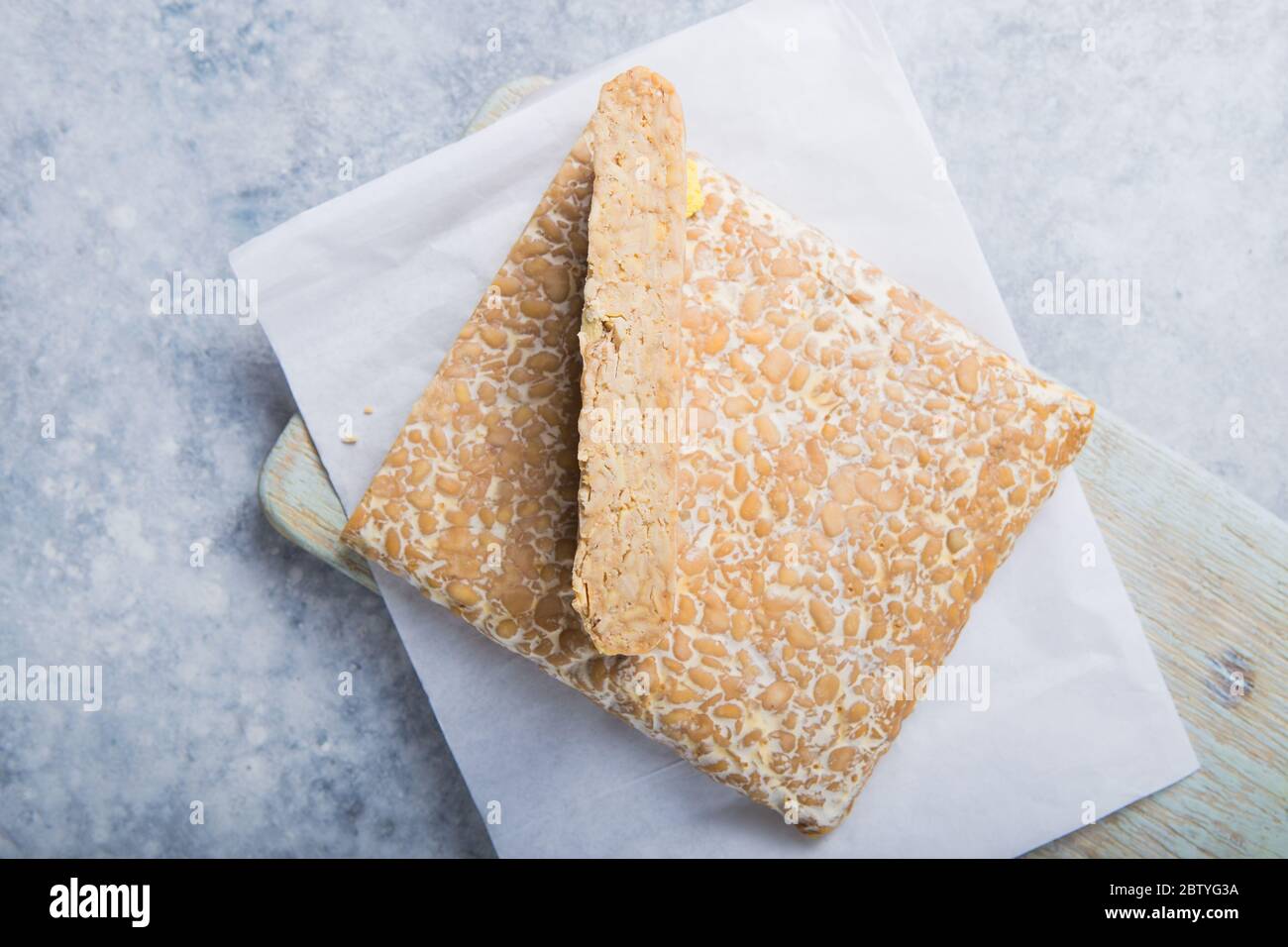 Slice of tempeh or tempe made of fermentation process that binds ...