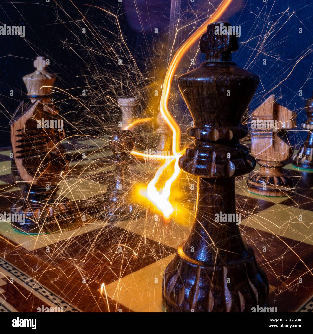 Chess Pieces with light trails and sparks Stock Photo - Alamy
