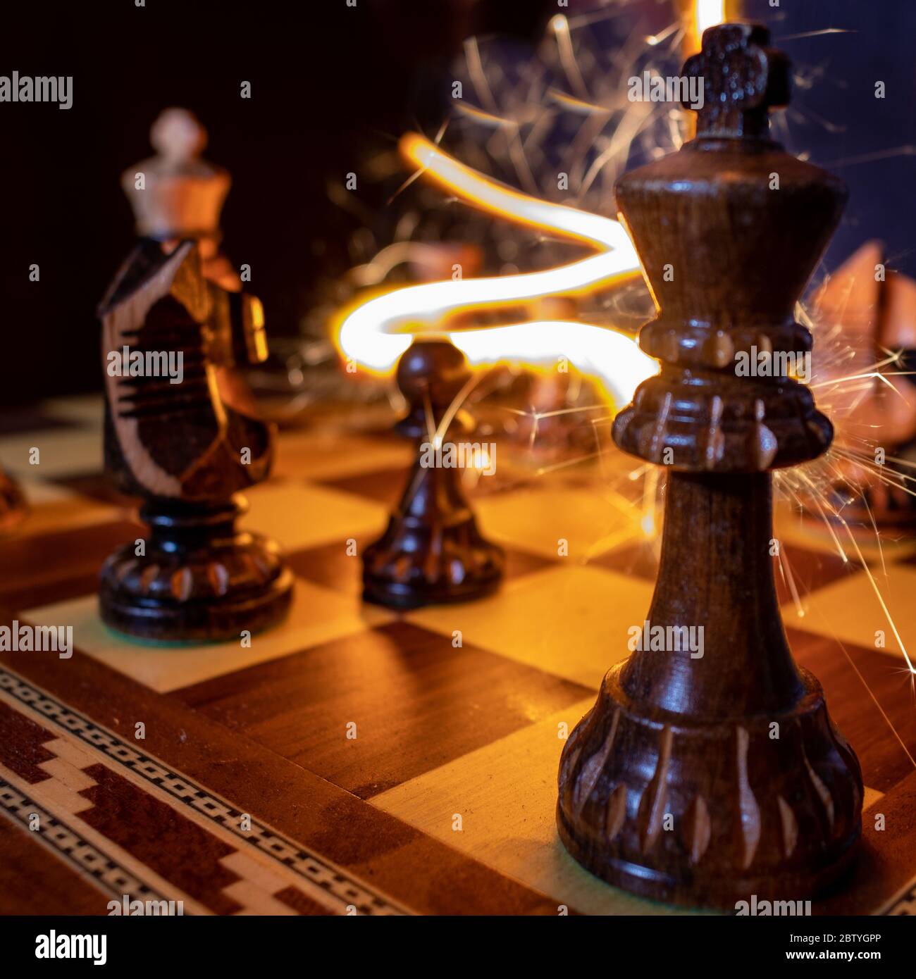 Chess Pieces with light trails and sparks Stock Photo - Alamy