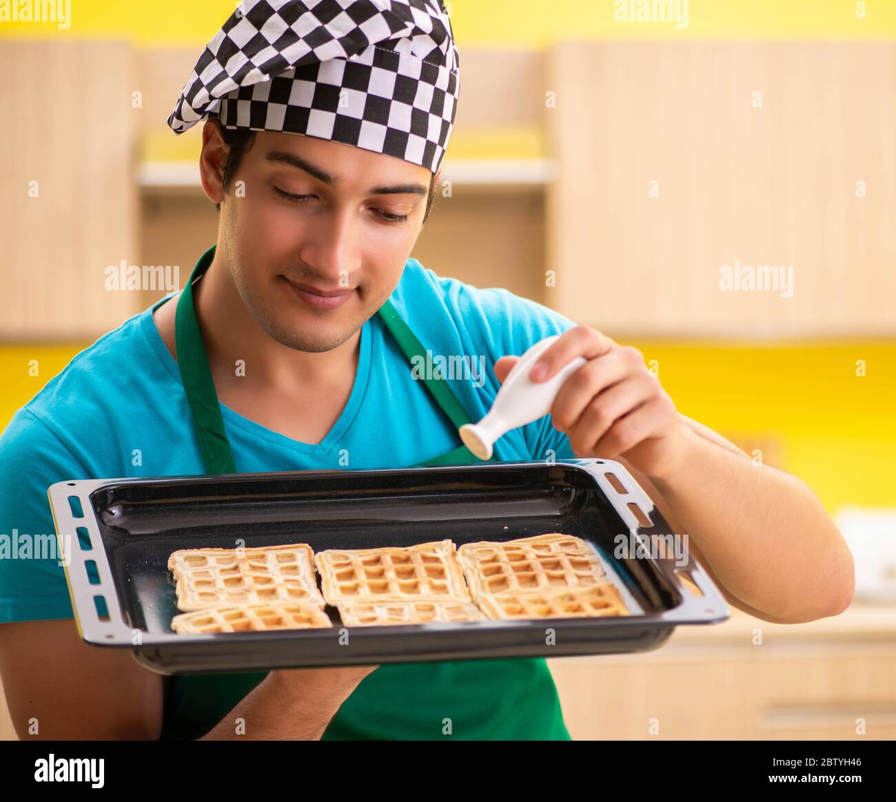 The man cook preparing cake in kitchen at home Stock Photo - Alamy