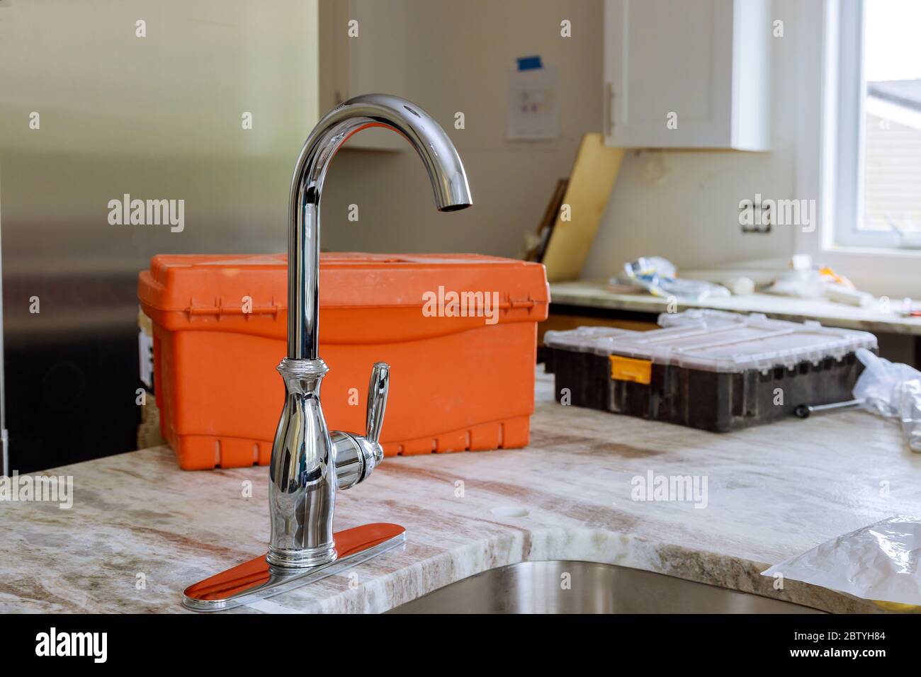 Plumber prepared to installing water tap on sink kitchen a new home ...