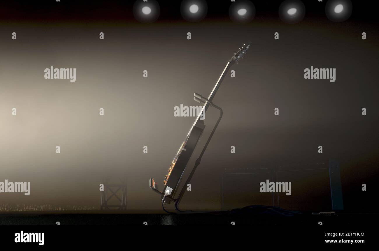 An electric guitar resting on a stand on a music concert stage lit by a ...