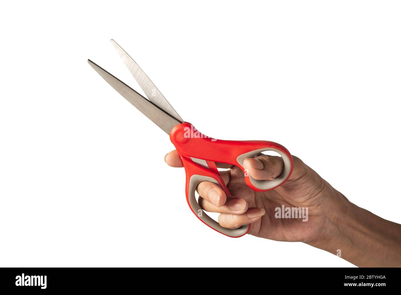 Hand holding a scissors with red plastic handle and clipping path ...