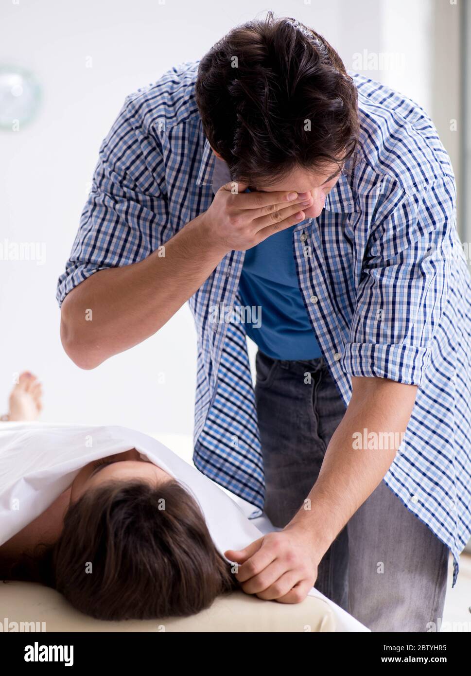 The man mourning his dead wife Stock Photo - Alamy