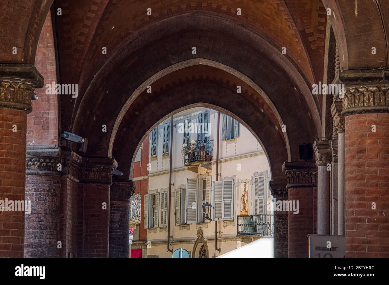 Beautiful look through an arch to some typical Italian houses Stock ...