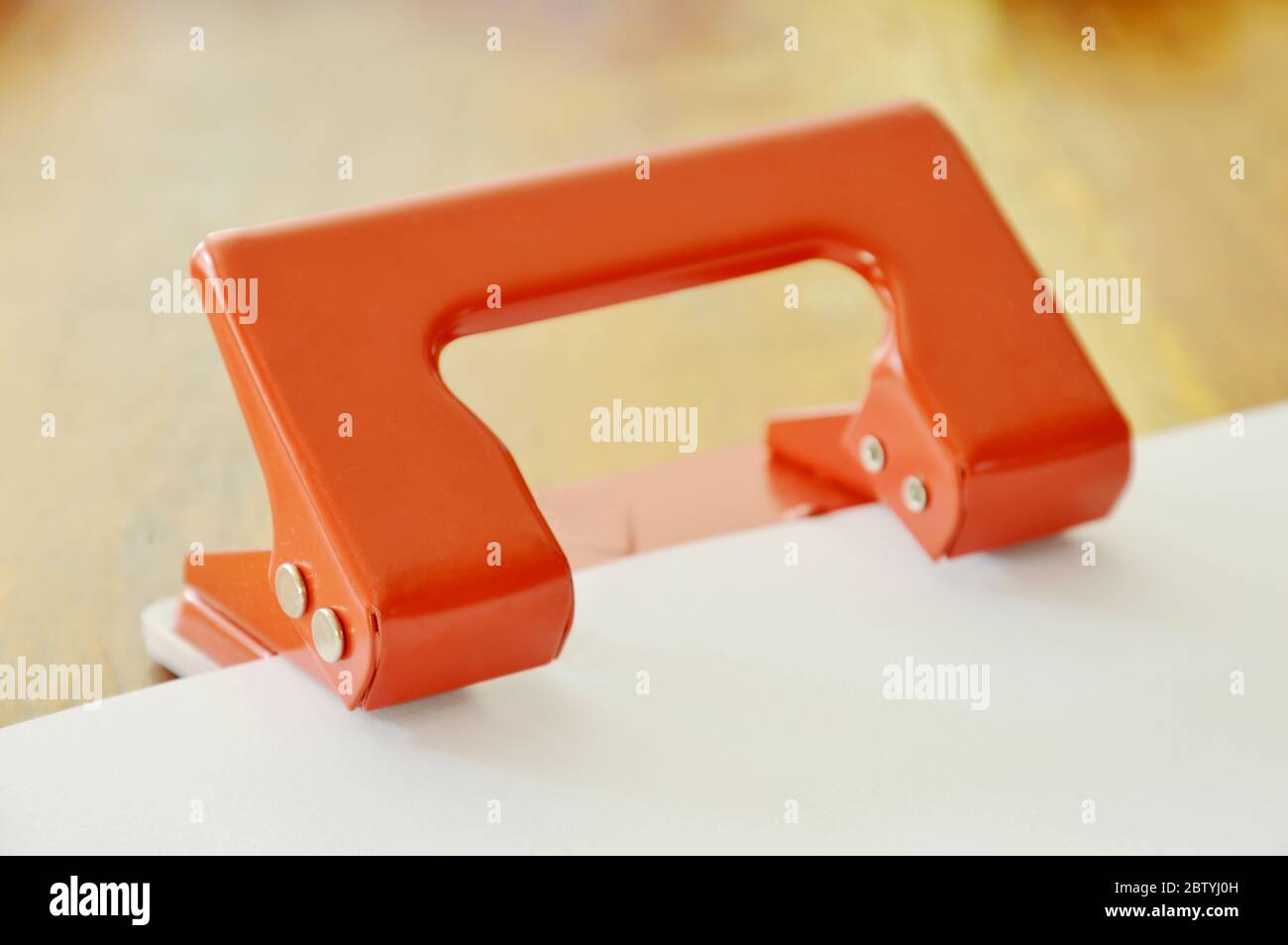 Iron hole punch hi-res stock photography and images - Alamy