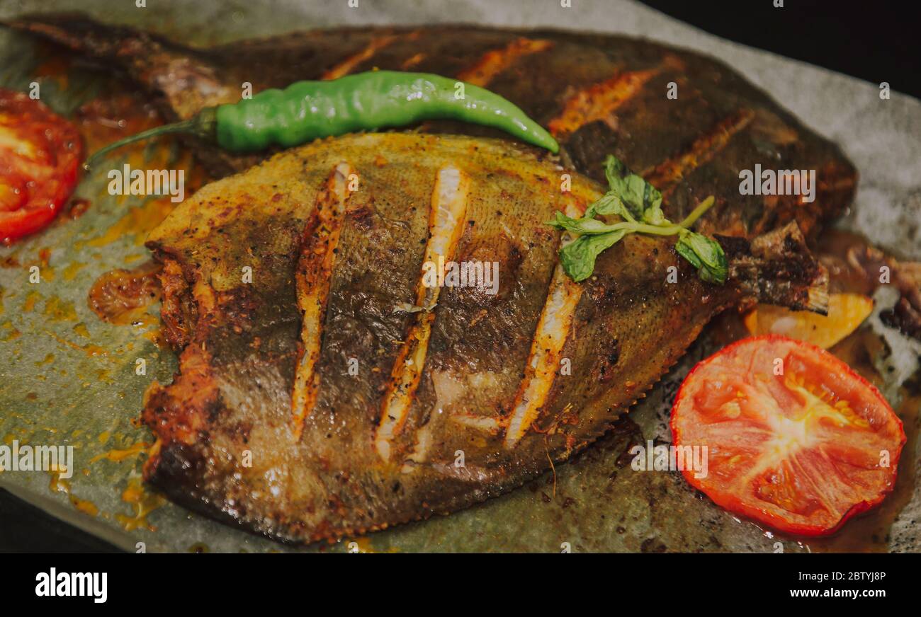 Black Pomfret grilled Stock Photo - Alamy