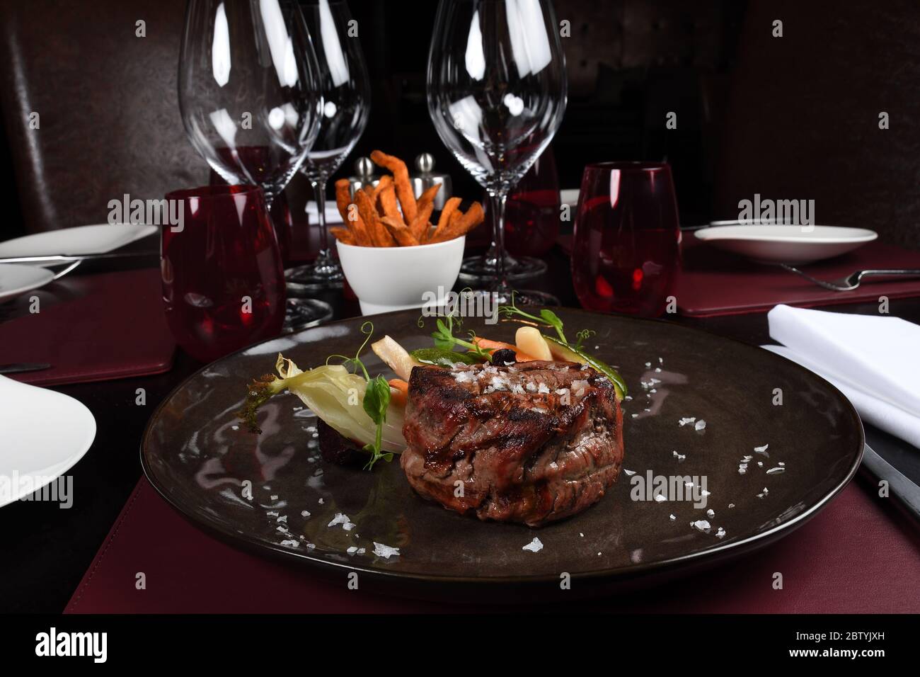 Rib eye steak, seasonal vegetables and sweet potatoes Fries in the ...