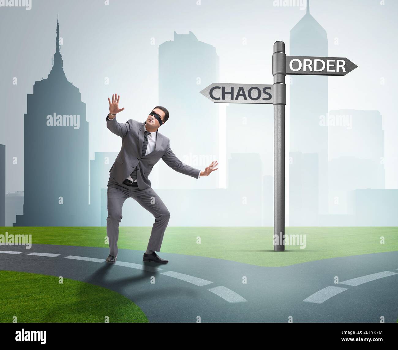 The businessman in difficult choice concept Stock Photo - Alamy