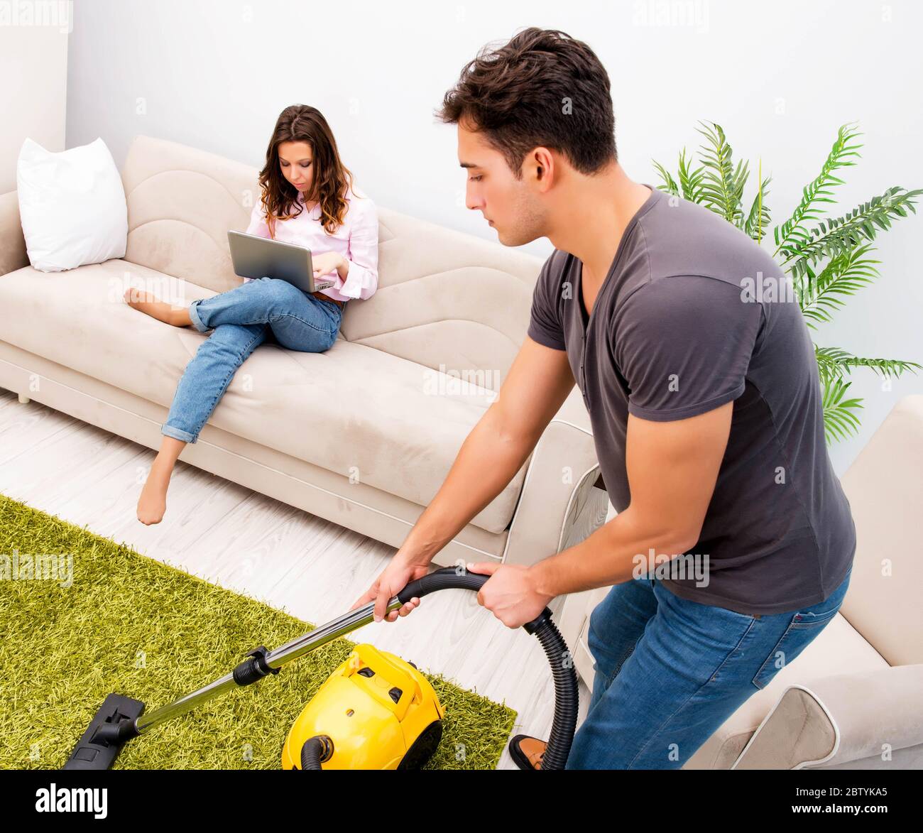 Cleaning the house with vacuum cleaner Stock Photo - Alamy