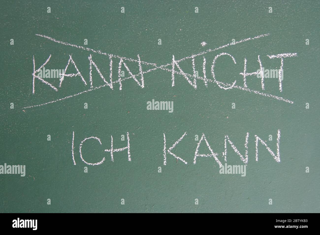 Motivation sign. Motivation note. Motivation note on a green board ...
