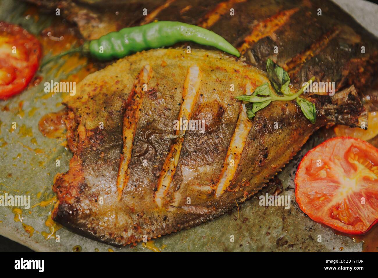 Black Pomfret grilled Stock Photo - Alamy