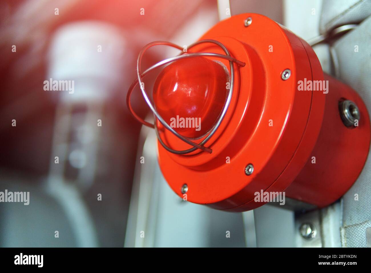 Red warning light of an emergency beacon at an industrial facility ...
