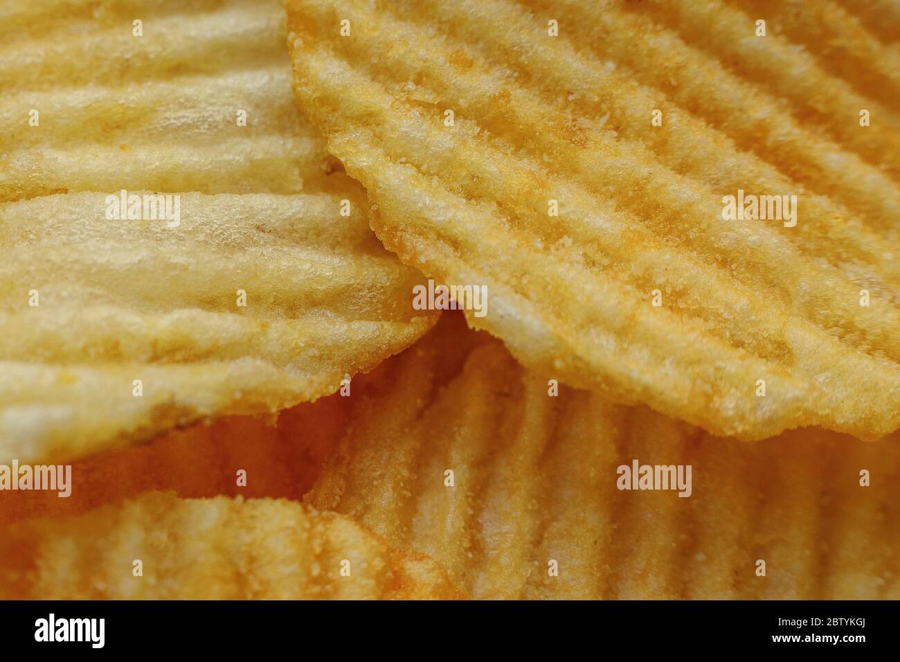 Corrugated Potato Chips. Close-up macro view Stock Photo - Alamy